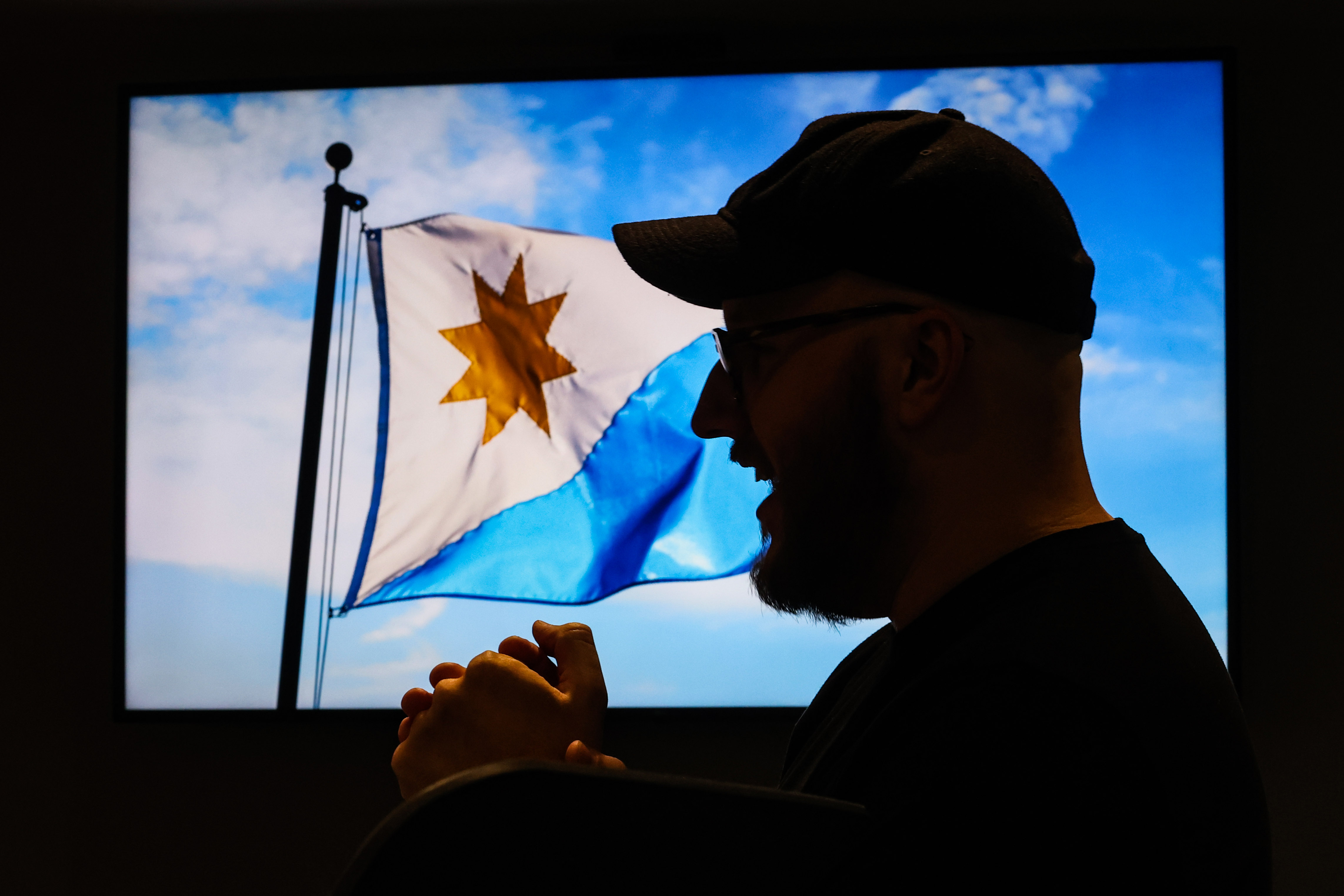 Graphic designer Jacob Parr poses for a photo with new city flag he ...