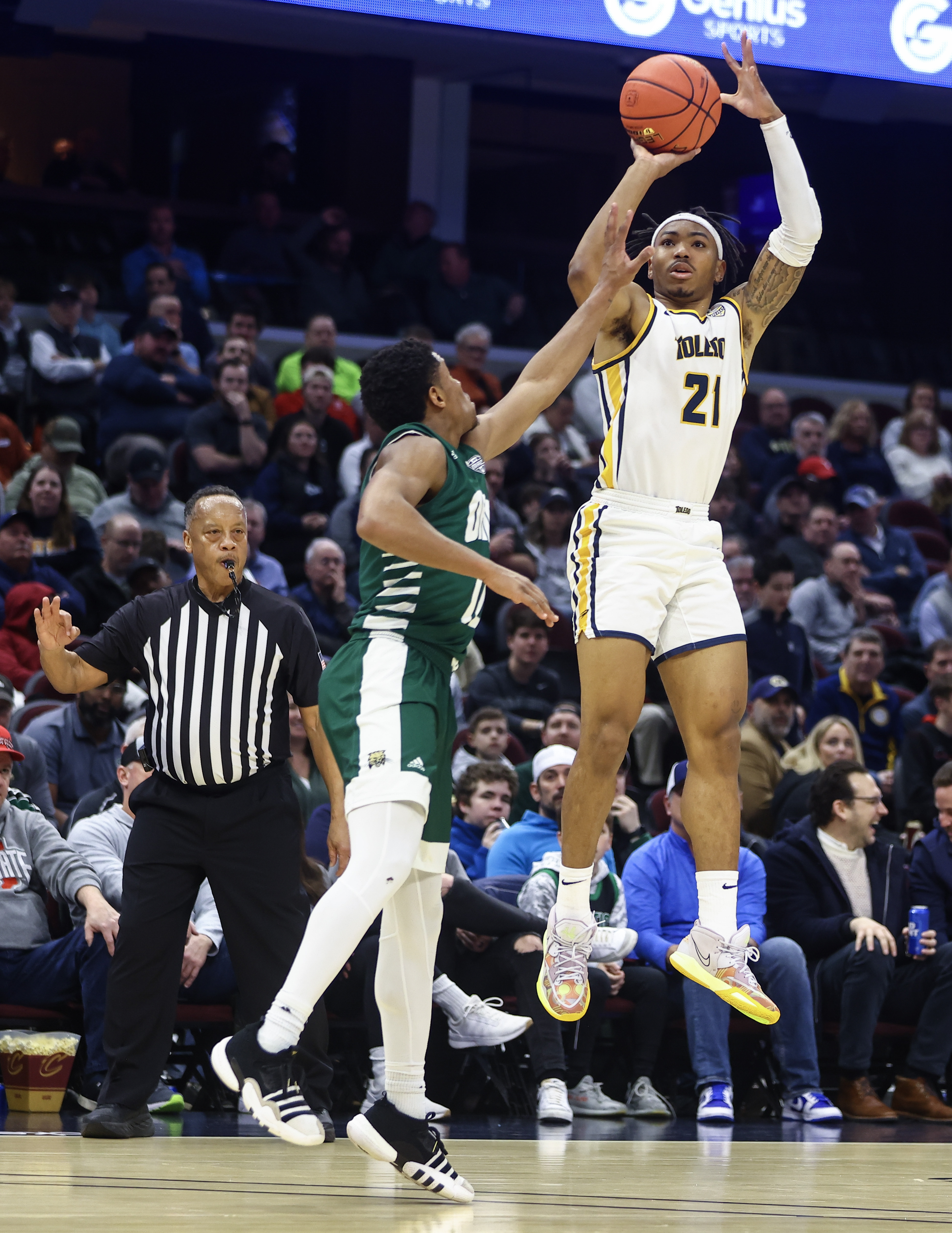 University of Toledo guard RayJ Dennis, right, shoots against Ohio ...